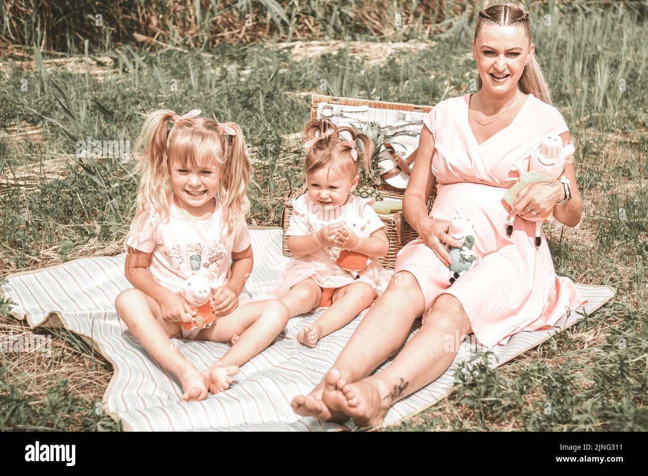 child family portrait outdoor mother woman and little girls happy ...