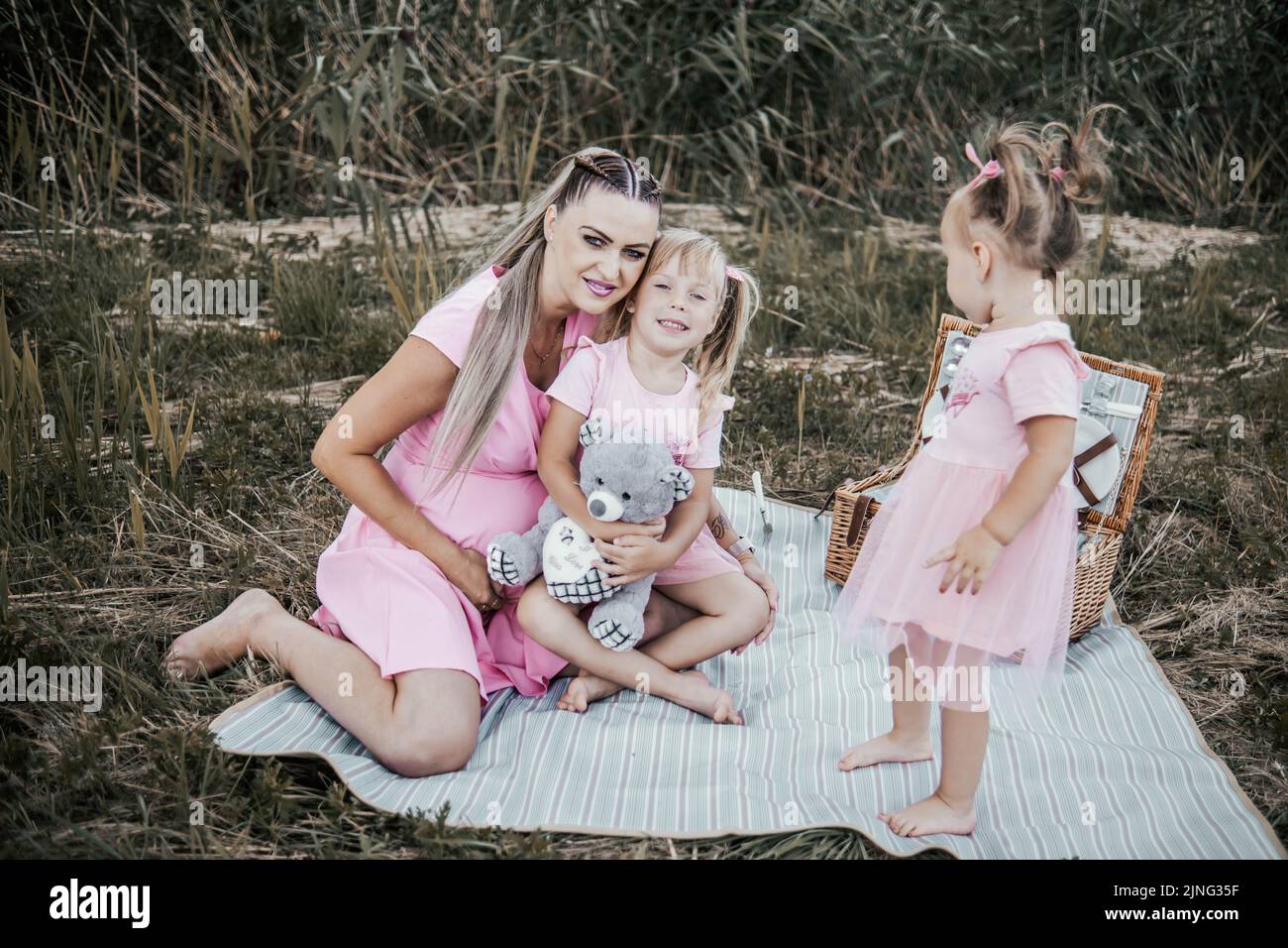 child family portrait outdoor mother woman and little girls happy ...