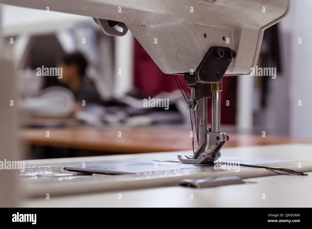 Sewing machine needles close-up in the workshop Stock Photo - Alamy