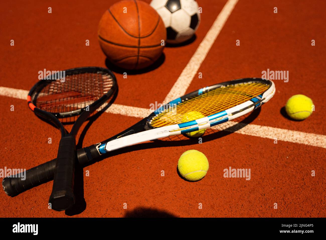 Set of sport equipment, rackets and tennis balls soccer and basketball ...