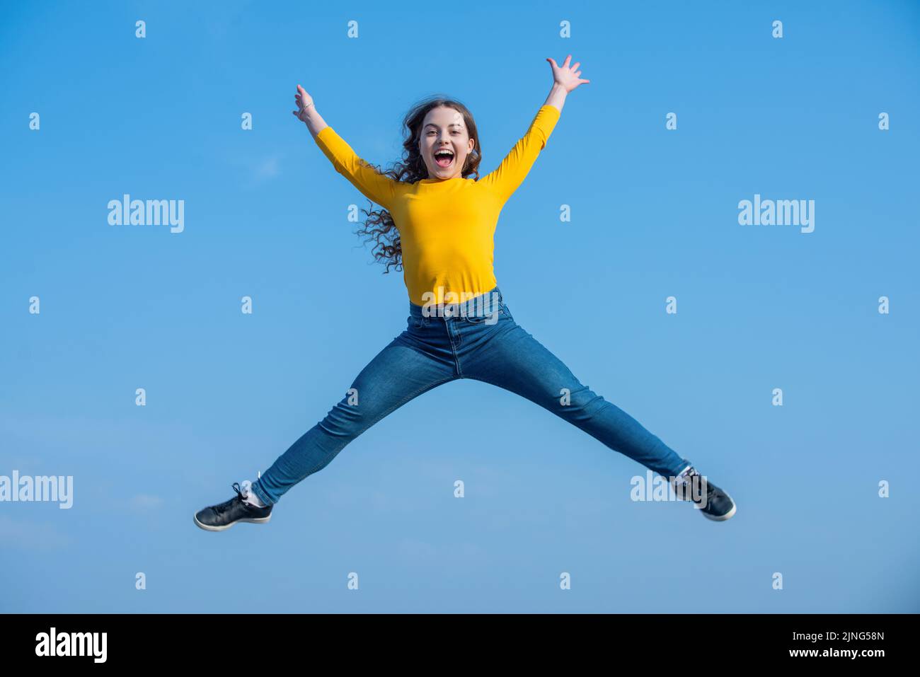 happy teen girl jump high on sky background. happiness Stock Photo - Alamy