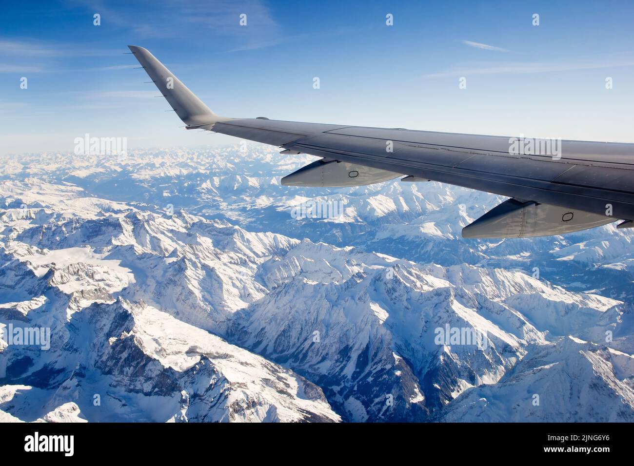 Plane over snow capped mountain hi-res stock photography and images - Alamy