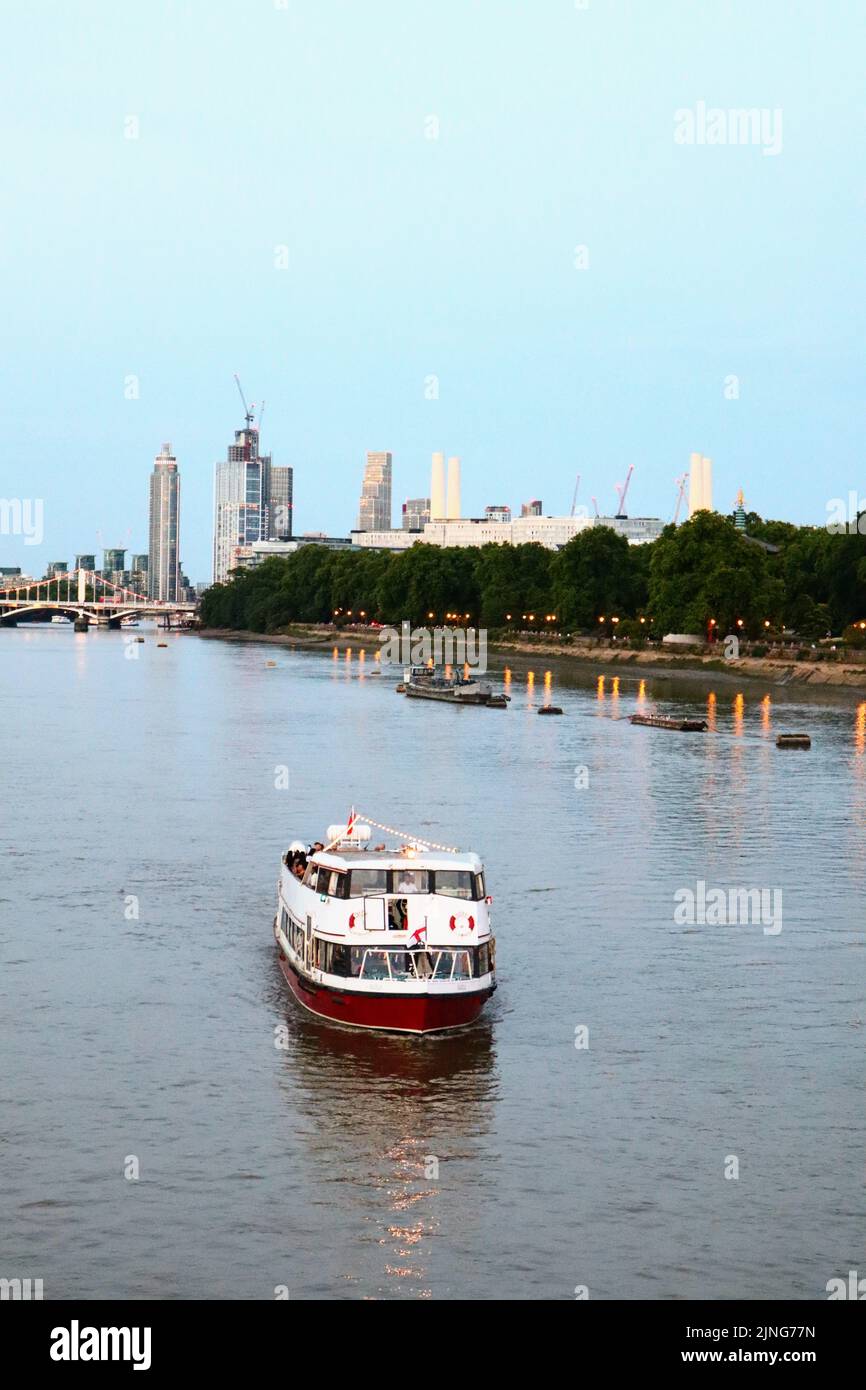 A vertical shot of the river Thames with Albert Bridge at distance ...
