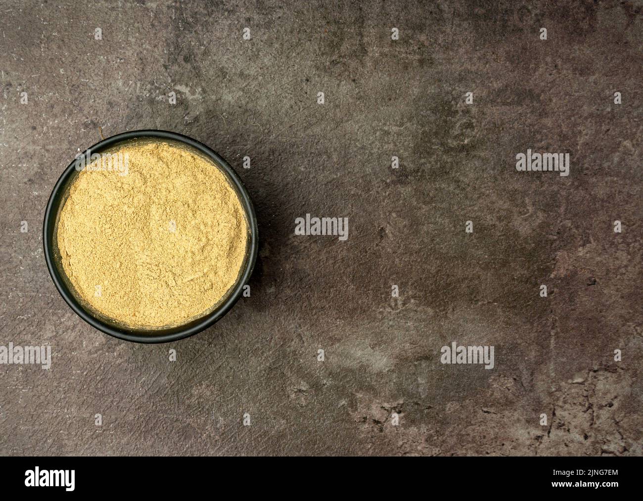 Aromatic Ginger powder from a flat lay angle with a dramatic dark ...