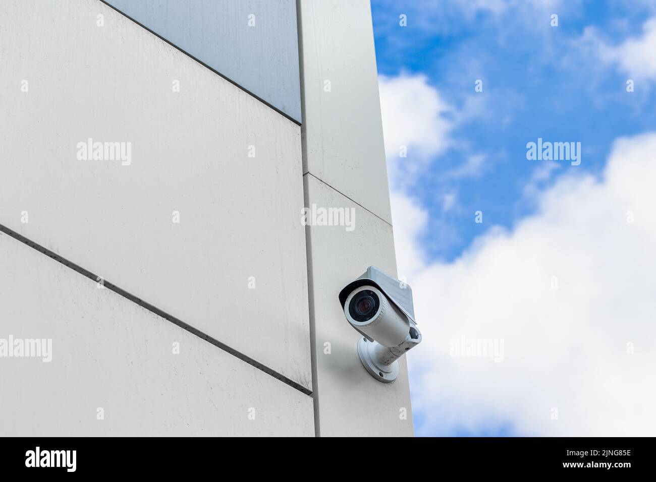 Security control camera or CCTV on cloudy sky background Stock Photo - Alamy