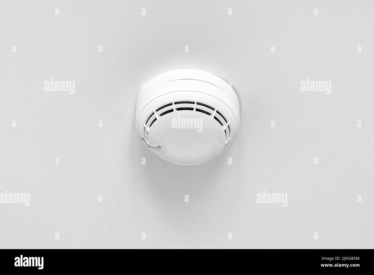 Smoke detector or fire alarm sensor on white ceiling Stock Photo - Alamy