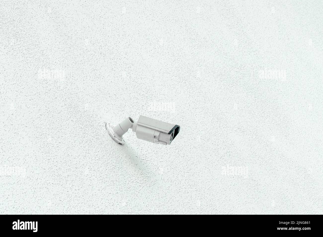 Security control camera or CCTV on a wall background Stock Photo - Alamy