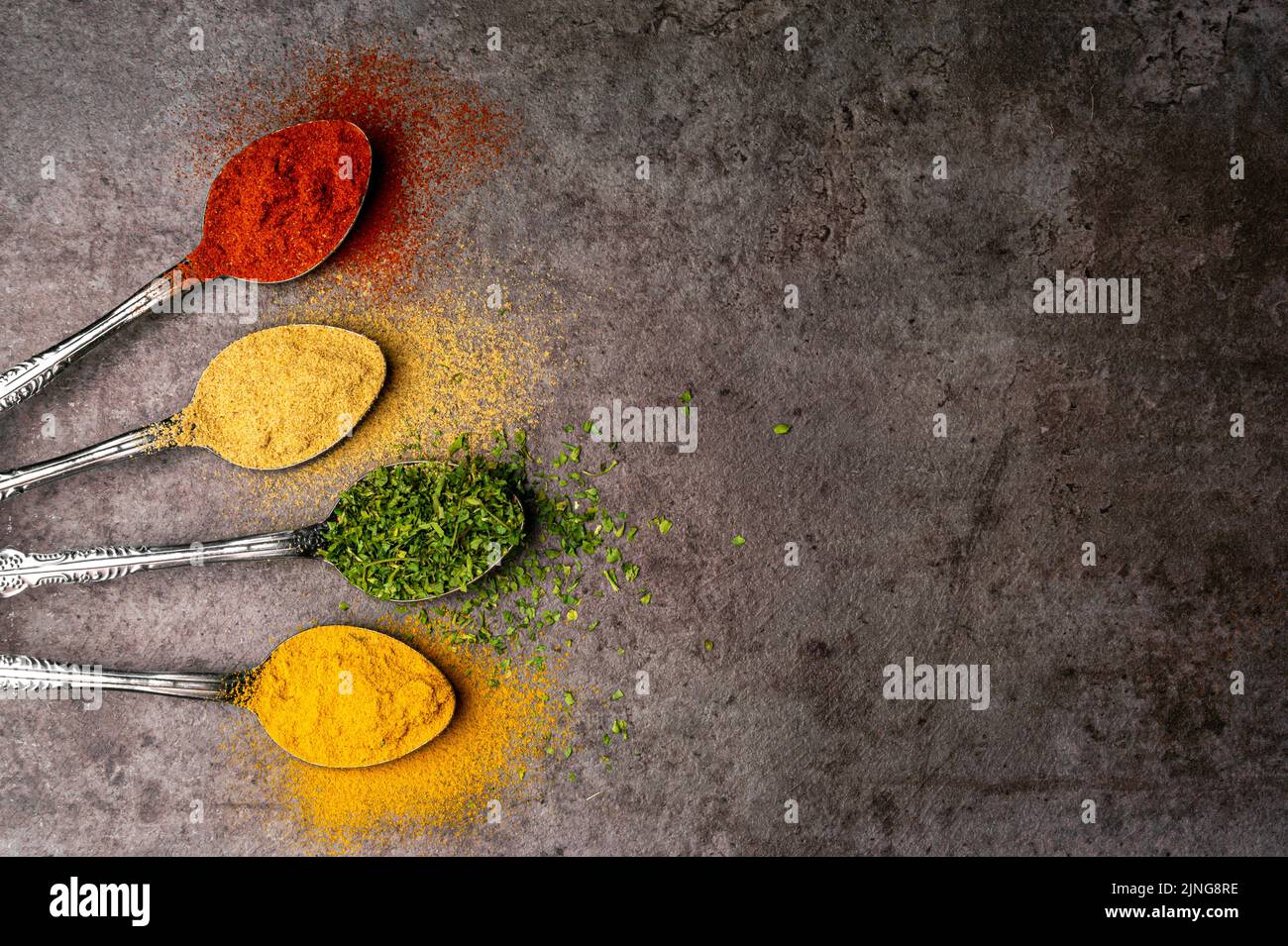 Assorted of colorful spices (red pepper powder, turmeric powder, black ...
