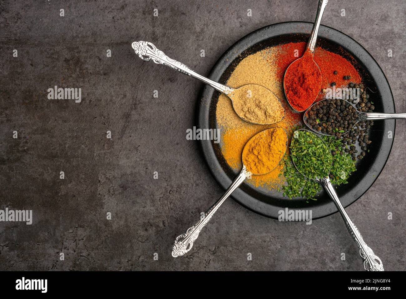 Assorted of colorful spices (red pepper powder, turmeric powder, black ...