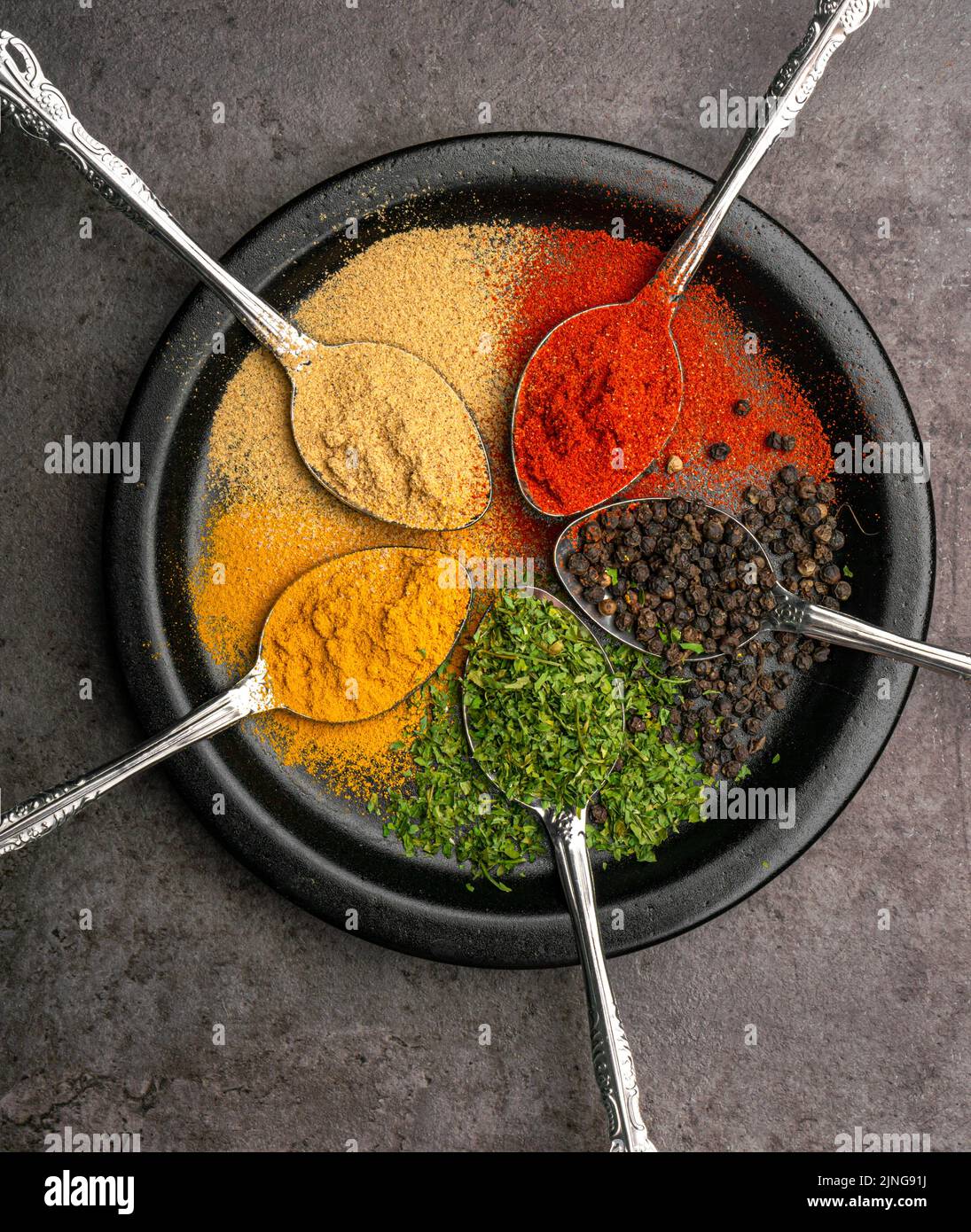 Assorted of colorful spices (red pepper powder, turmeric powder, black ...