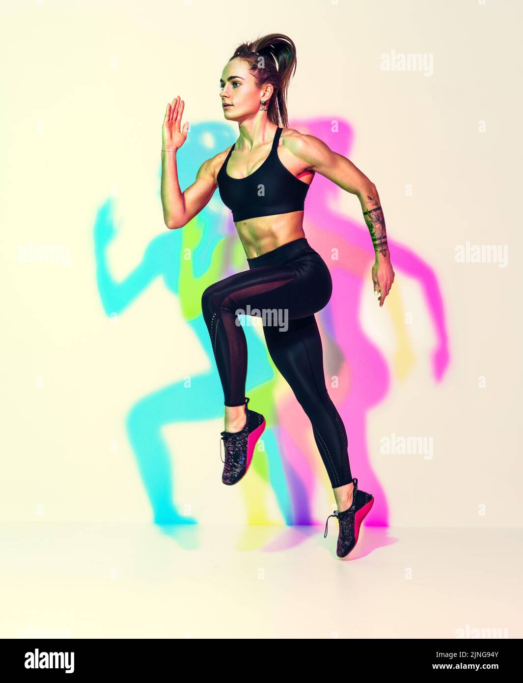 Sporty woman runner in silhouette. Photo of muscular woman in black ...