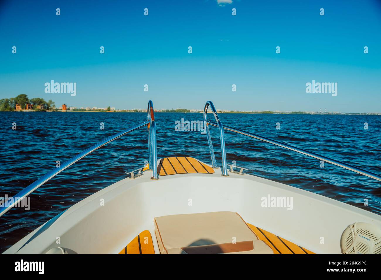 First-person view of the water surface. White luxury motor boat . The ...