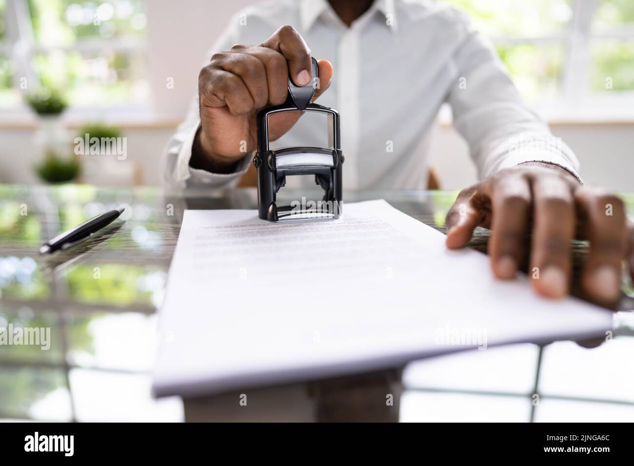 African American Black Man Using Notary Stamp On Official Paper Stock ...