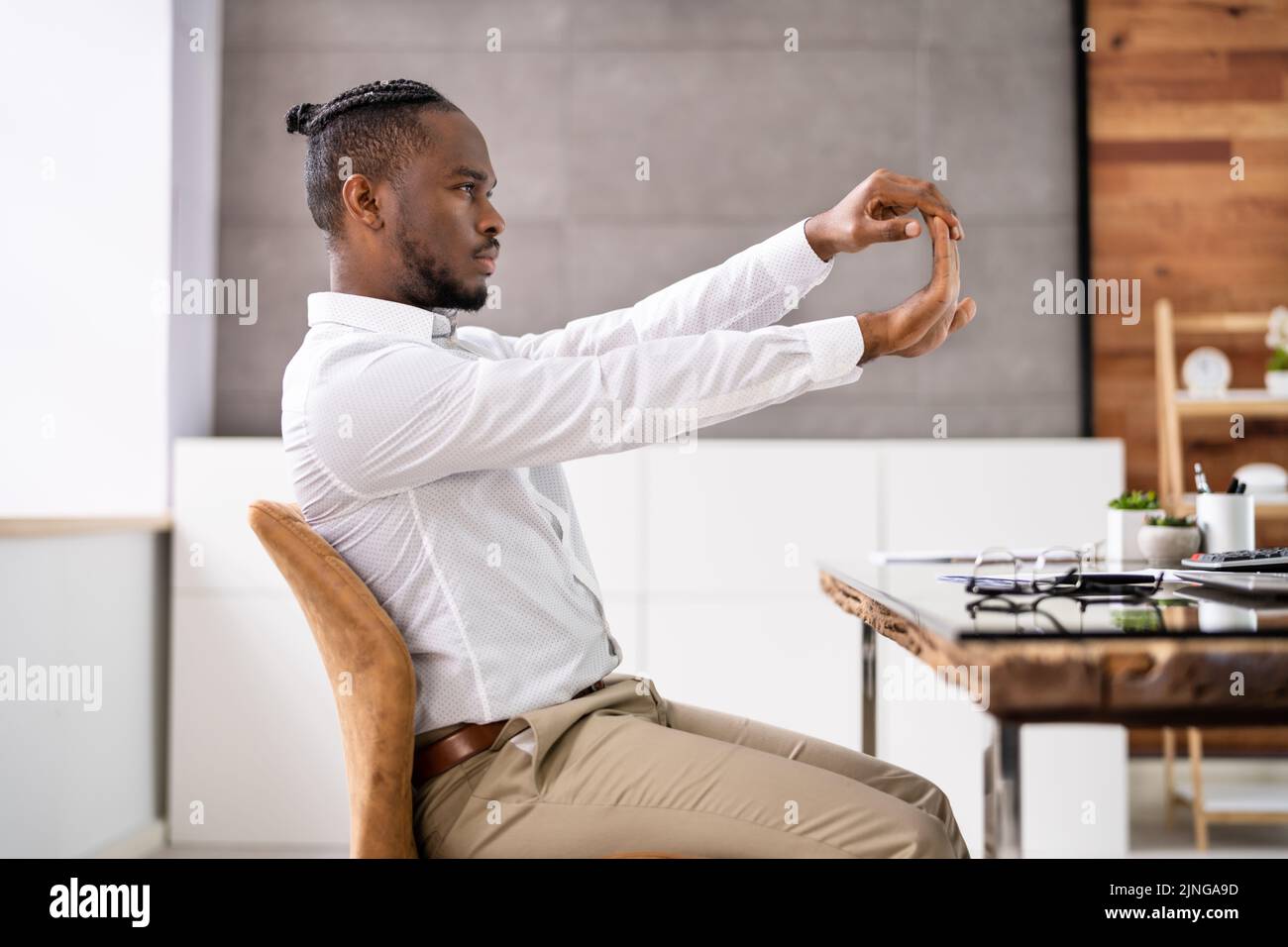 Stretch Exercise Workout At Office Business Desk Stock Photo - Alamy