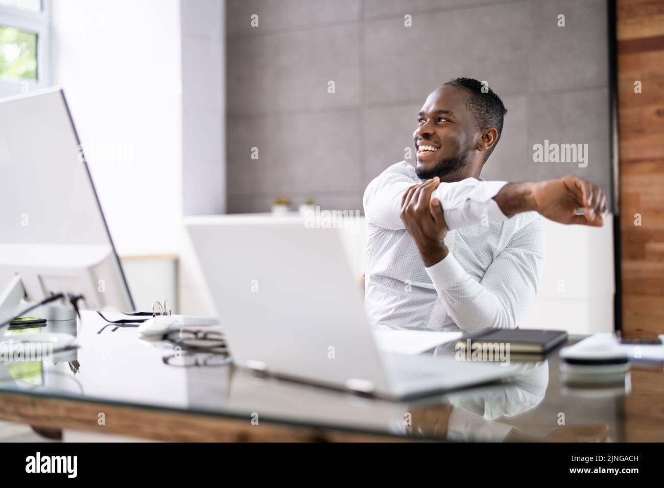Stretch Exercise Workout At Office Business Desk Stock Photo - Alamy