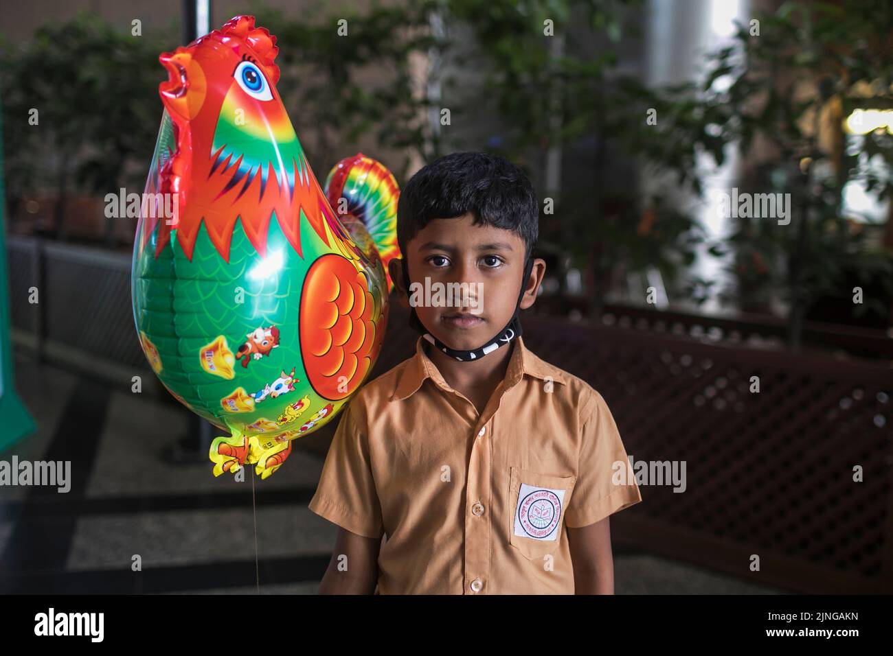 A boy poses for a photo after receiving a dose of Pfizer-BioNTech covid ...