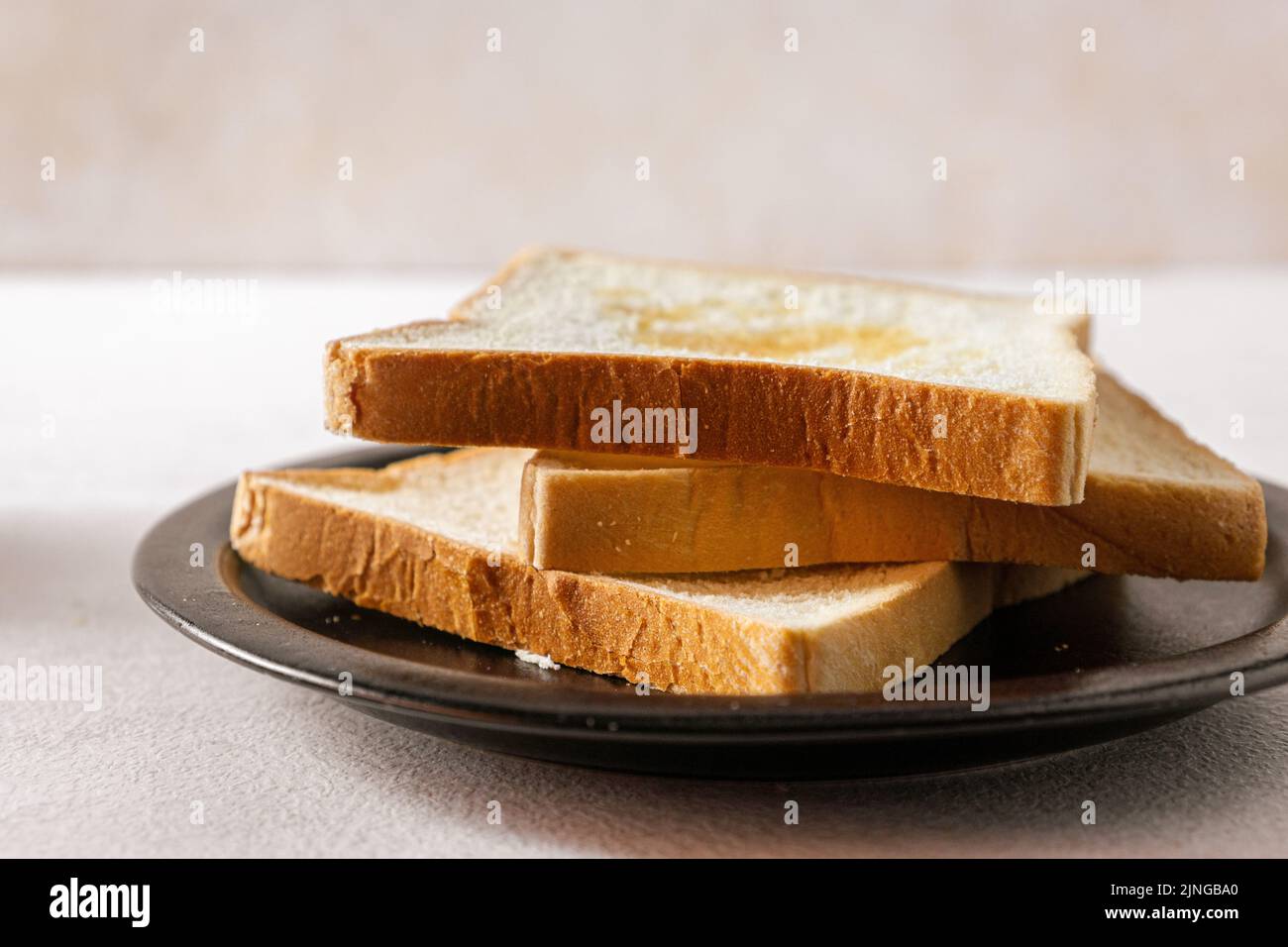 Sliced white bread on a desk. Close up. Bright mood. Horizontal ...