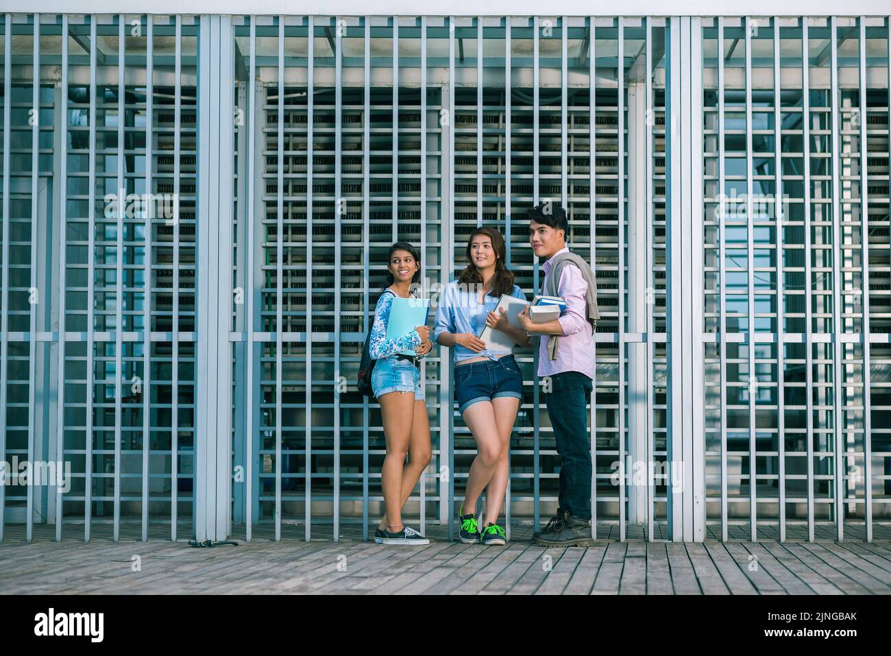 Asian high school students with books and textbooks Stock Photo - Alamy