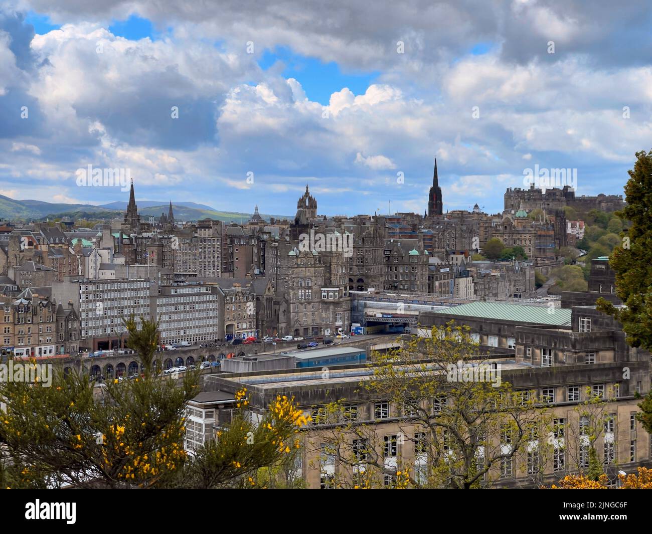 An aerial view of Edinburgh cityscape against blue cloudy sky ...