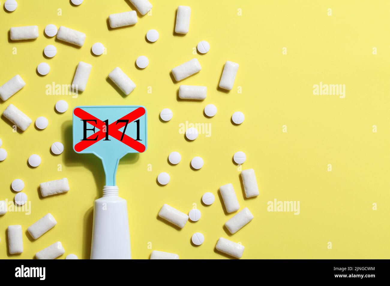 Titanium dioxide, E171, dangerous additive concept. gum, pills ...