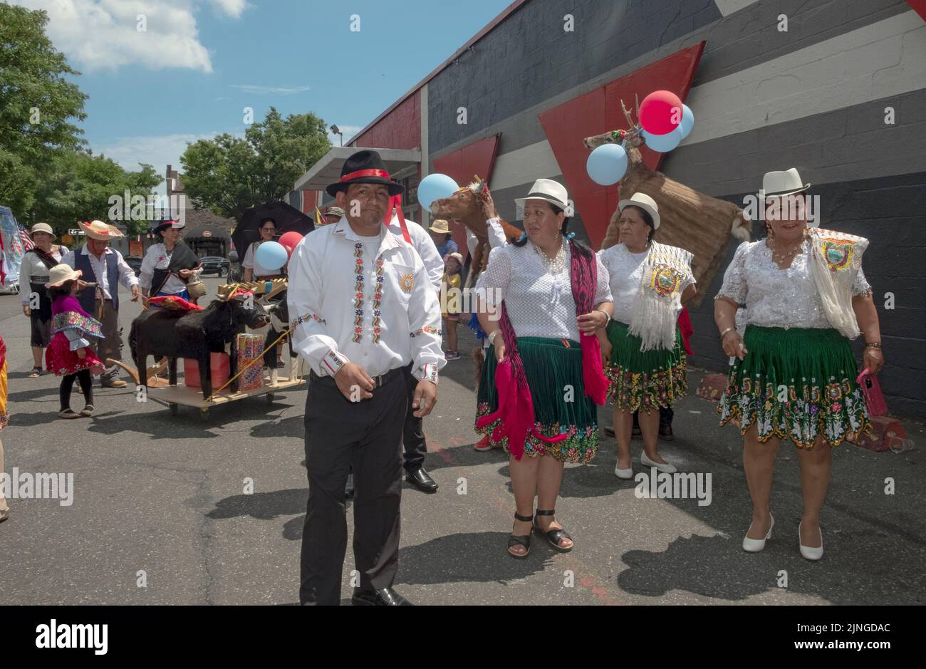 Marchers in traditional clothing and with wooden animal statues.at the ...
