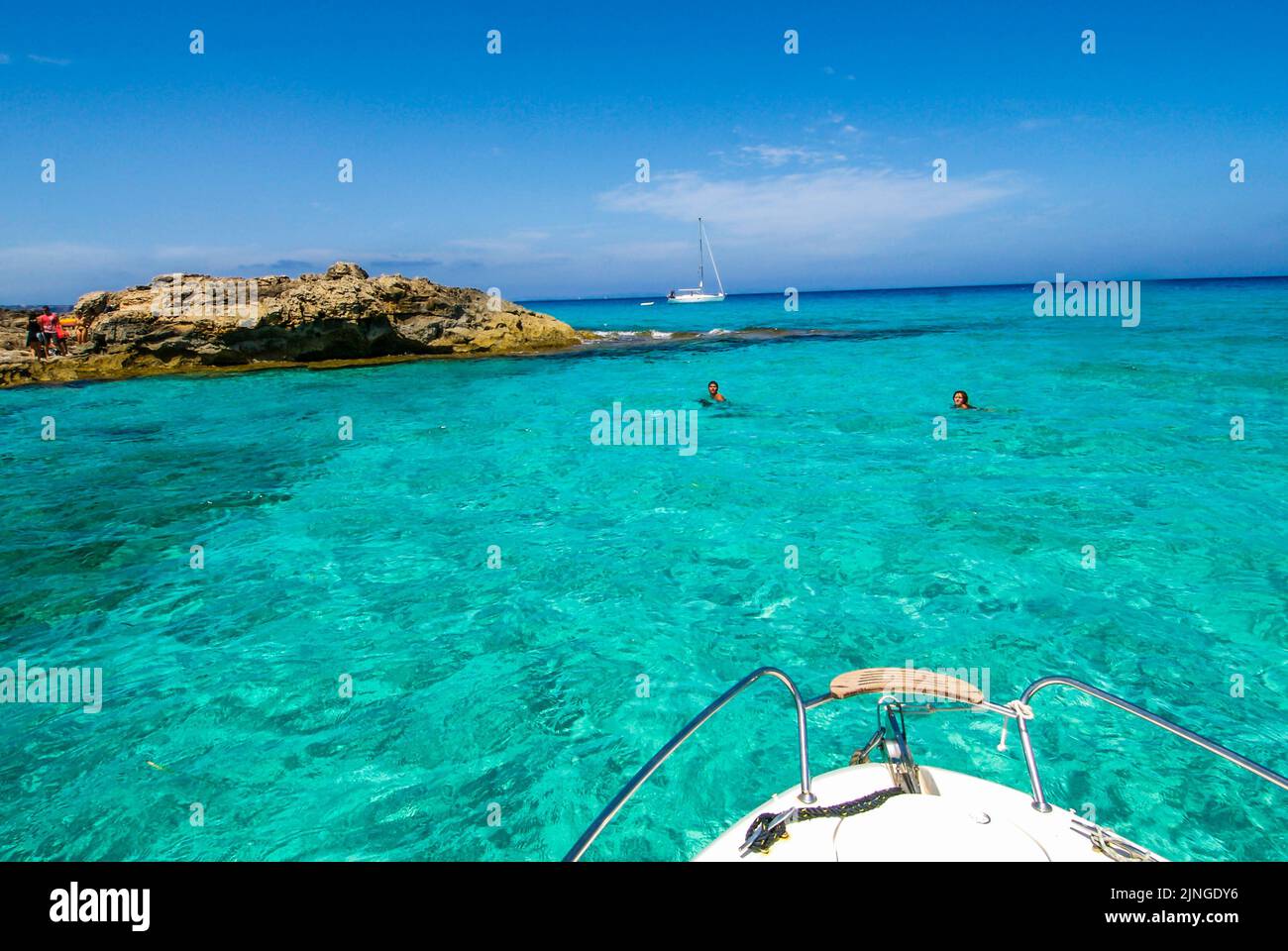 Couple swimming in Formentera, shot from yacht Stock Photo - Alamy