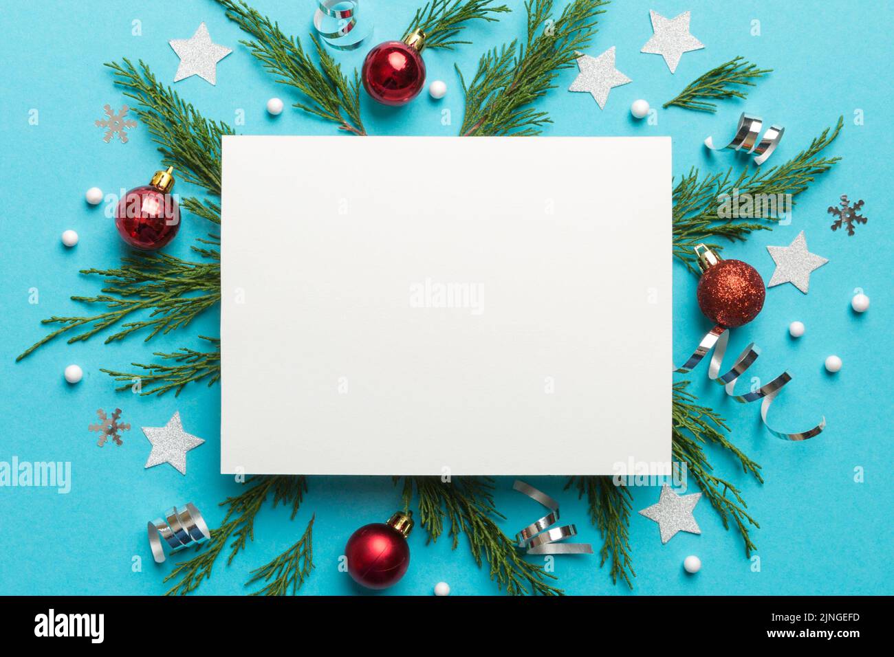 Flat lay Christmas composition. square Paper blank, pine tree branches ...