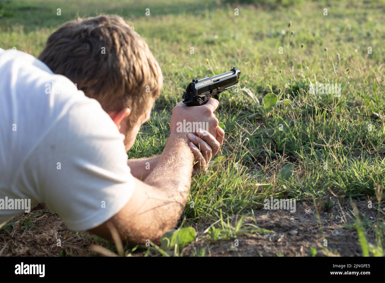 Man shooting target gun hi-res stock photography and images - Alamy