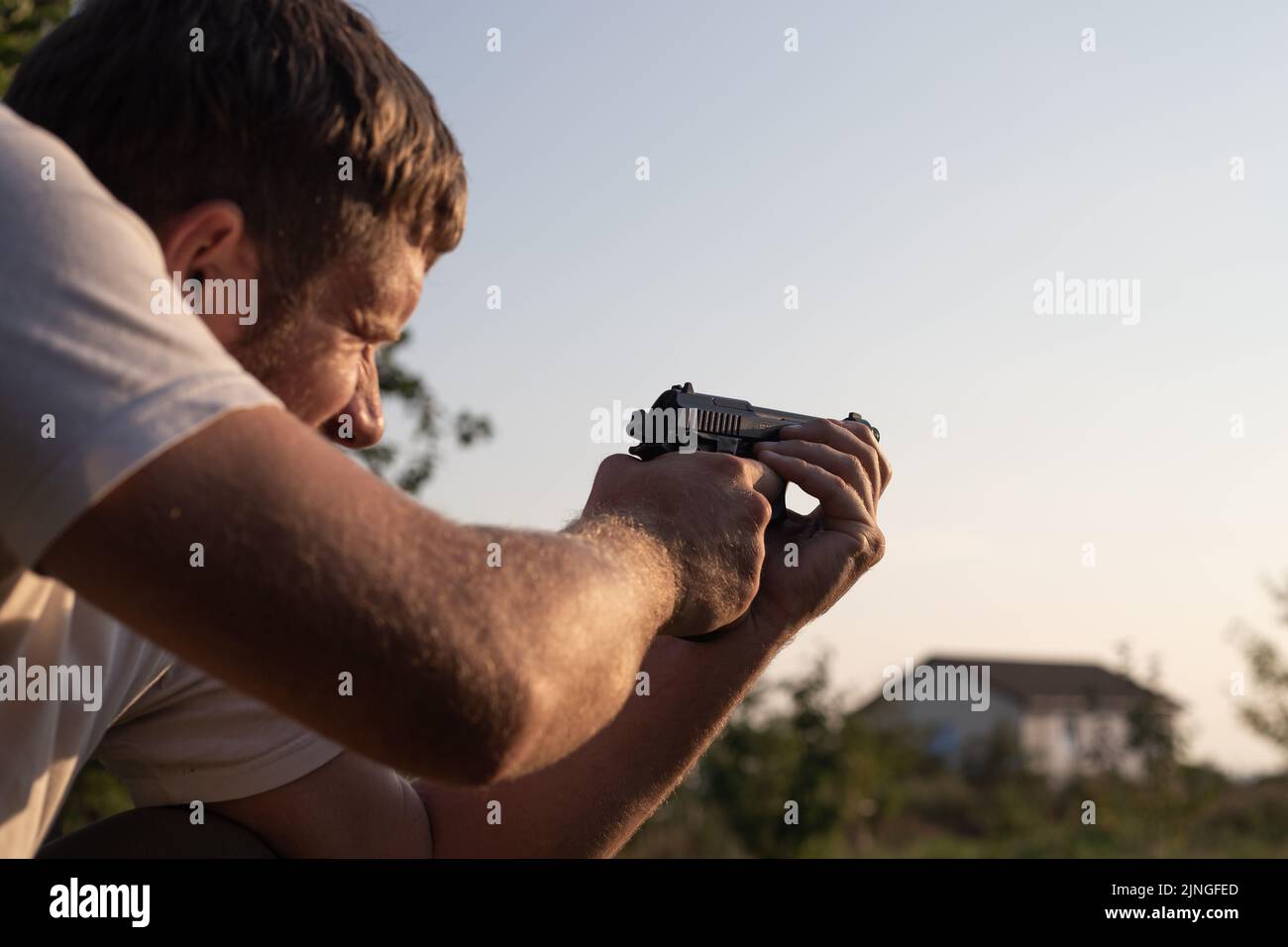 Man about to shoot gun hi-res stock photography and images - Alamy