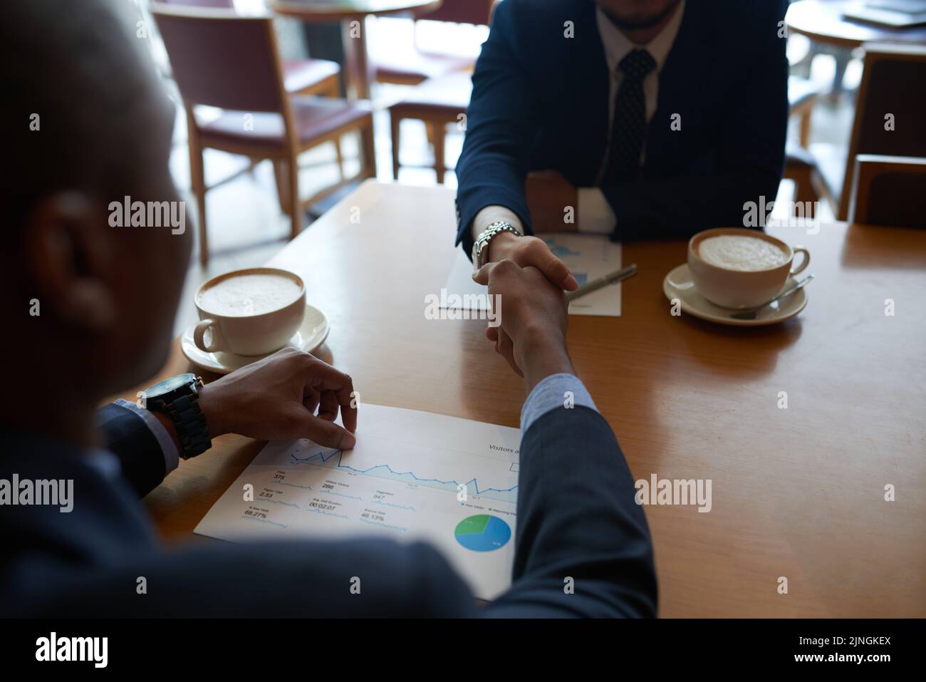 Business partners shaking hands before discussing project Stock Photo ...
