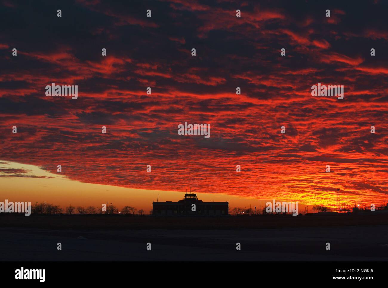 Ryan visitor center at Floyd Bennet Field with dramatic sunset clouds ...