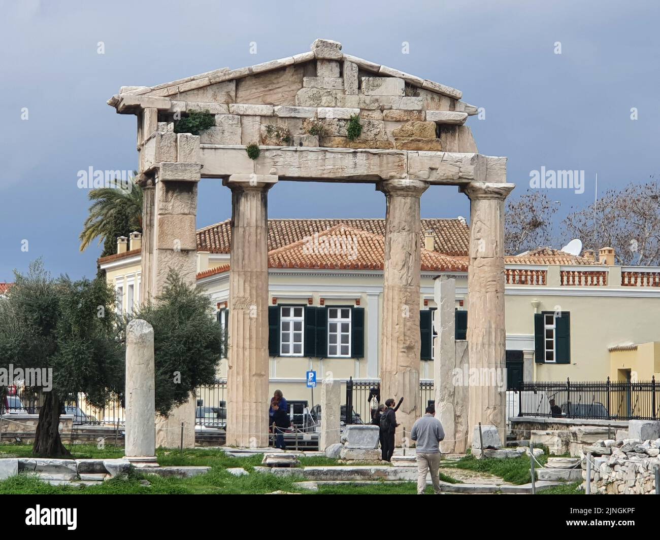 Ancient greek column ruins as a gate on a cloudy day Stock Photo - Alamy