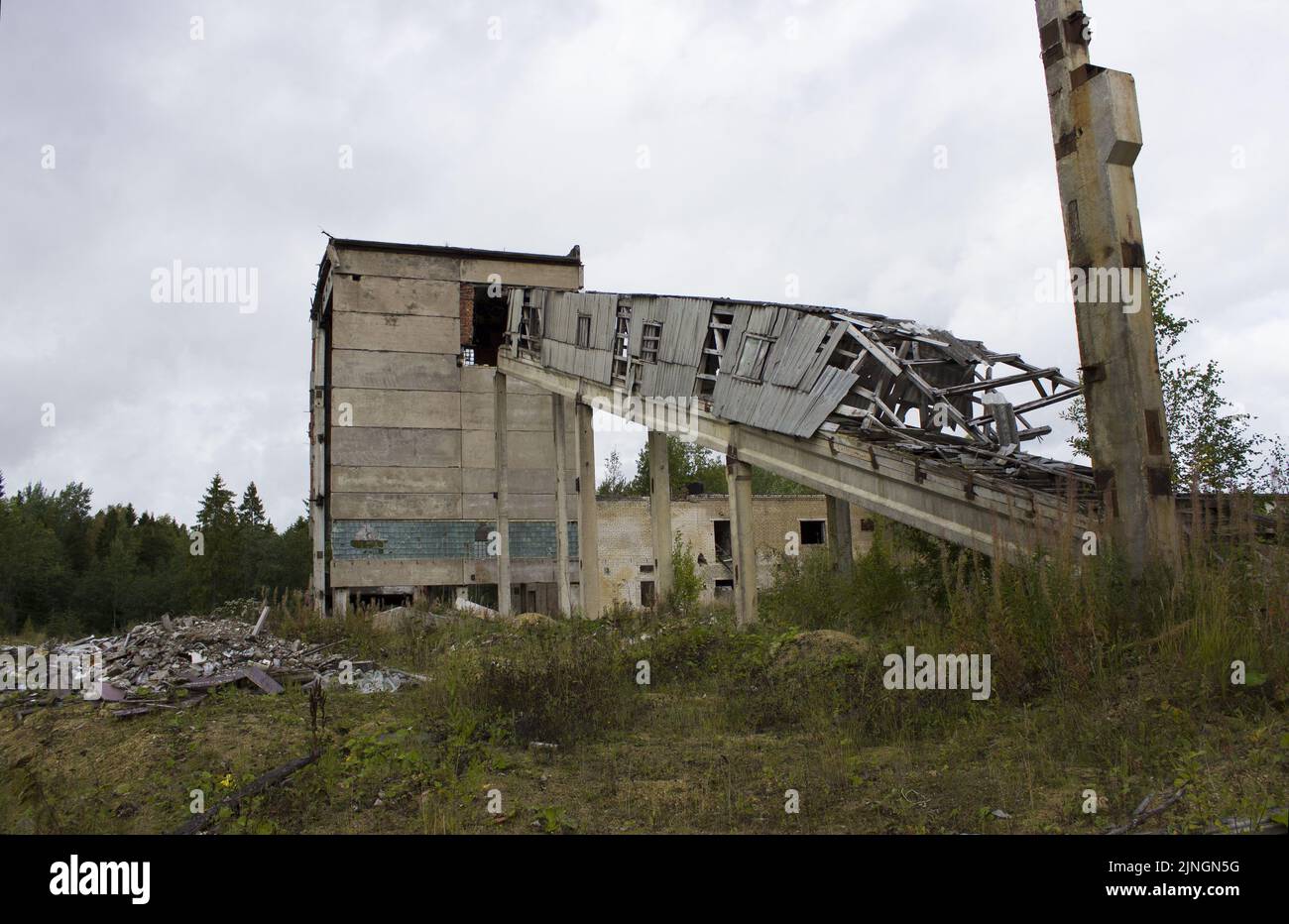 abandoned ruined building. concrete walls with broken windows and a ...