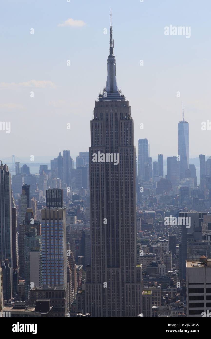 A vertical shot of a skyline of the Empire State building in New York ...