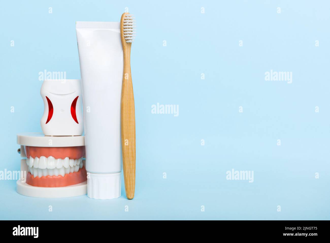 Mouthwash and other oral hygiene products on colored table top view ...