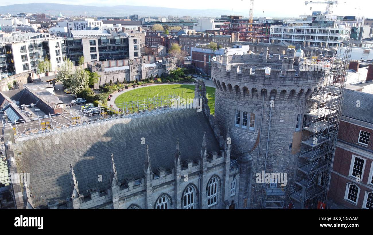A breathtaking aerial view of the Dublin castle with its surrounding tall buildings in Ireland ...