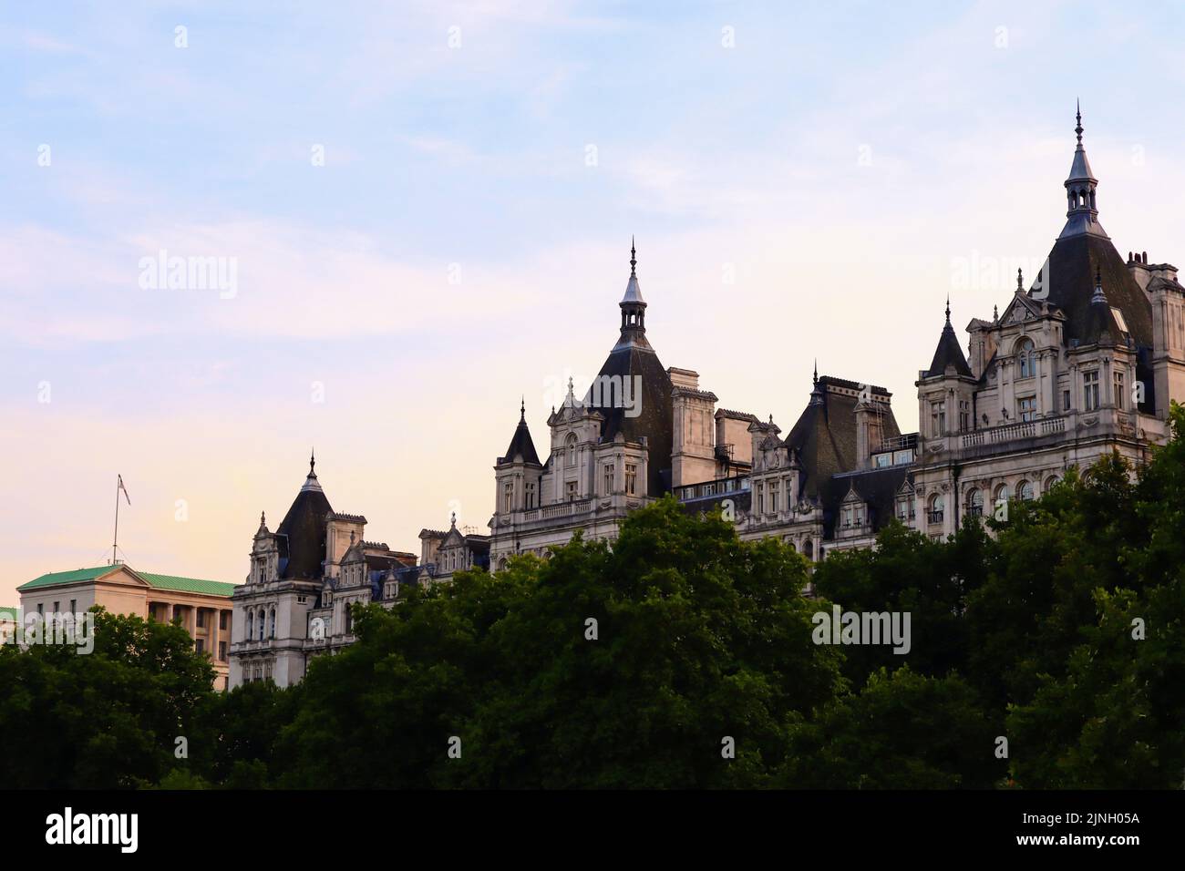 The beautiful One Whitehall Place in London with trees in front and ...