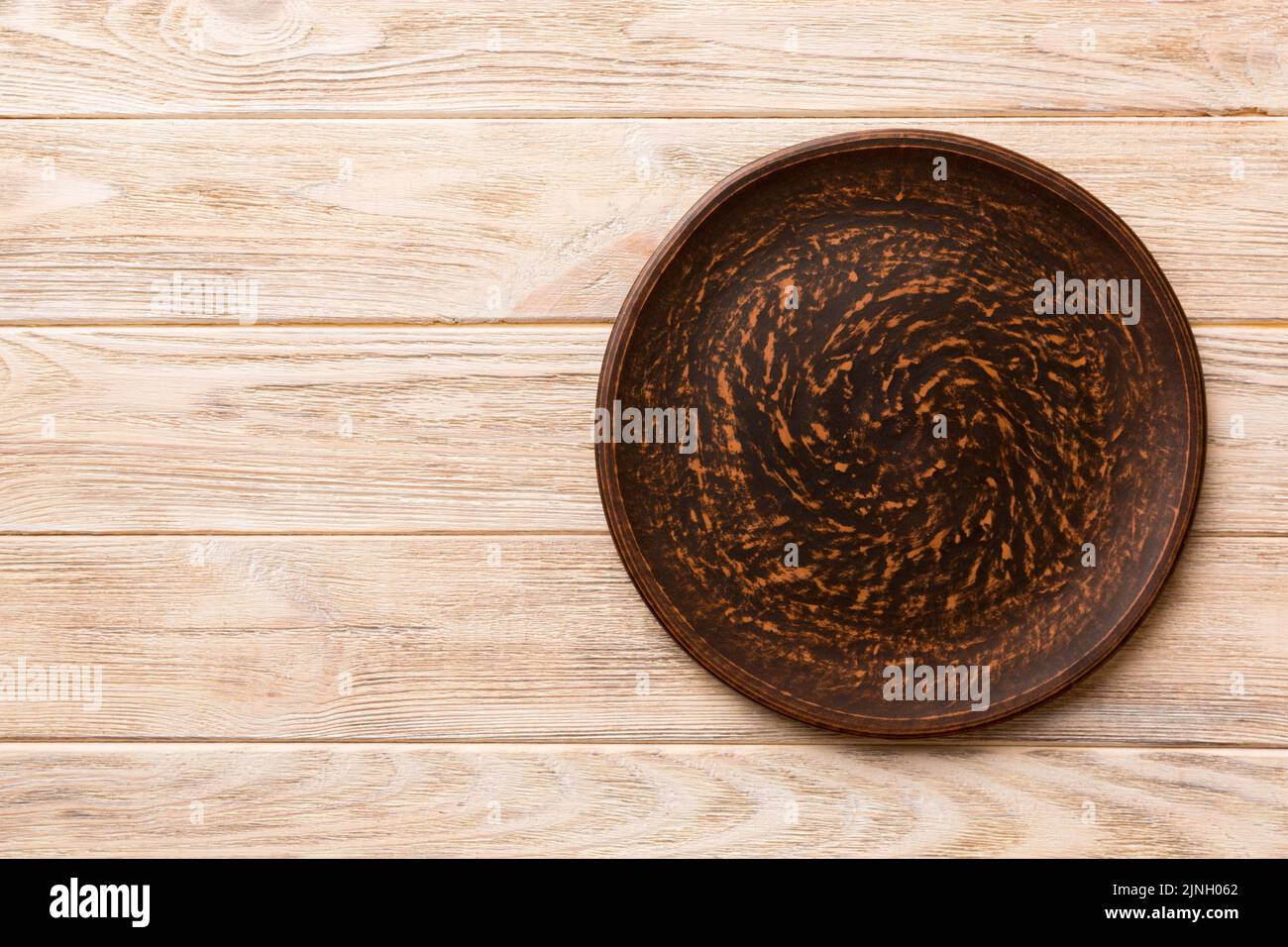 Top view of empty plate on wooden background. Empty space for your ...