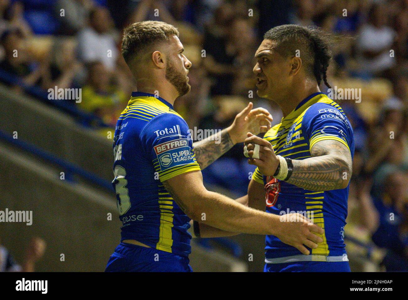 Connor Wrench #23 of Warrington Wolves celebrates his try Stock Photo ...