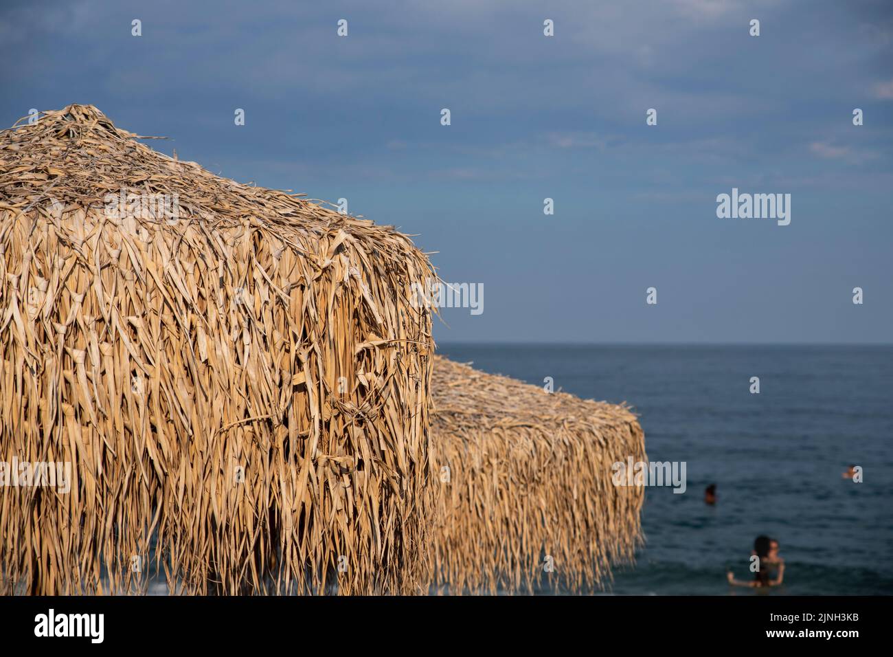 Umbrella made from palm tree leaves at the beach. Tropical style Stock ...