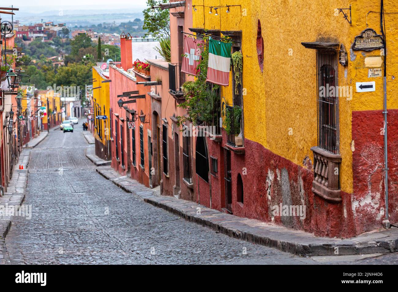 A view looking down Pila Seca lined with colorful Spanish colonial ...