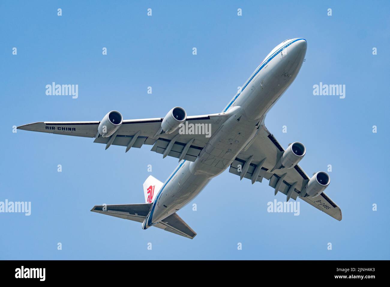 A low angle shot of Air China Boeing 747 against a sunny blue sky Stock ...