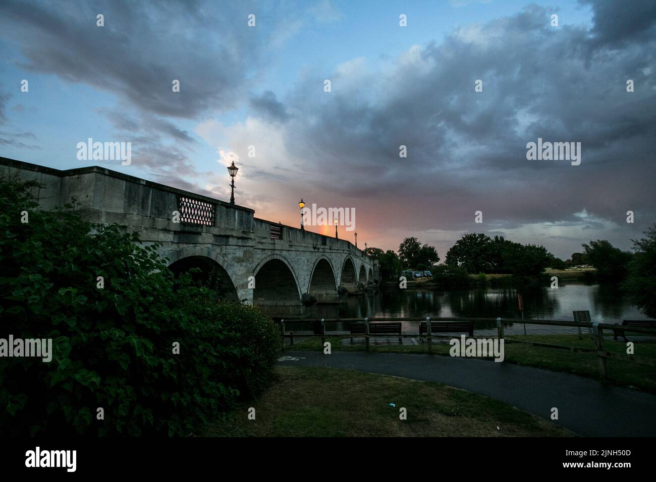 Moody Landscape Picture Of Chertsey Bridge Under Interesting Lighting Moody Landscape Picture Of Chertsey Bridge Under Interesting Lighting
