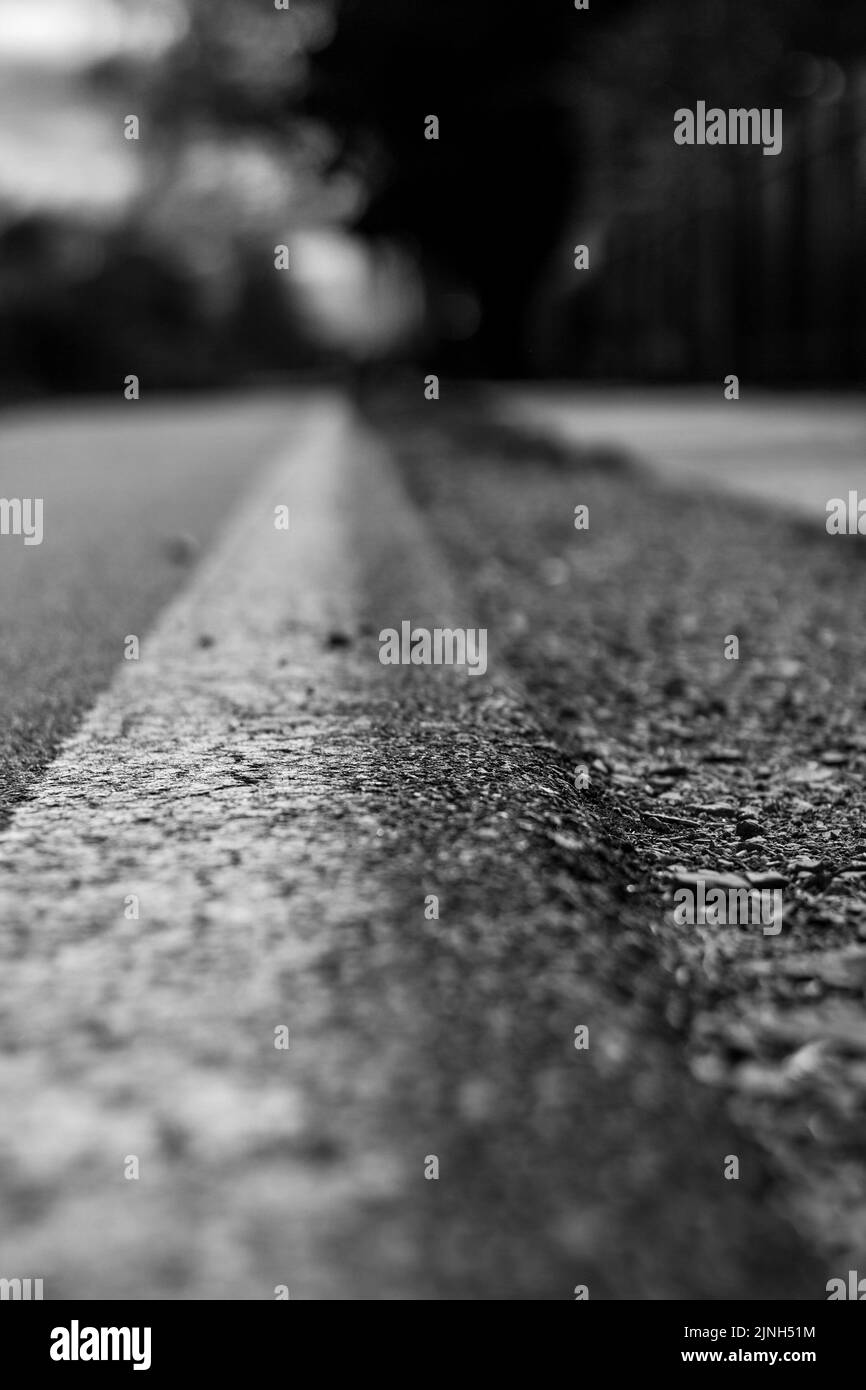 A vertical grayscale of an asphalt ground Stock Photo - Alamy
