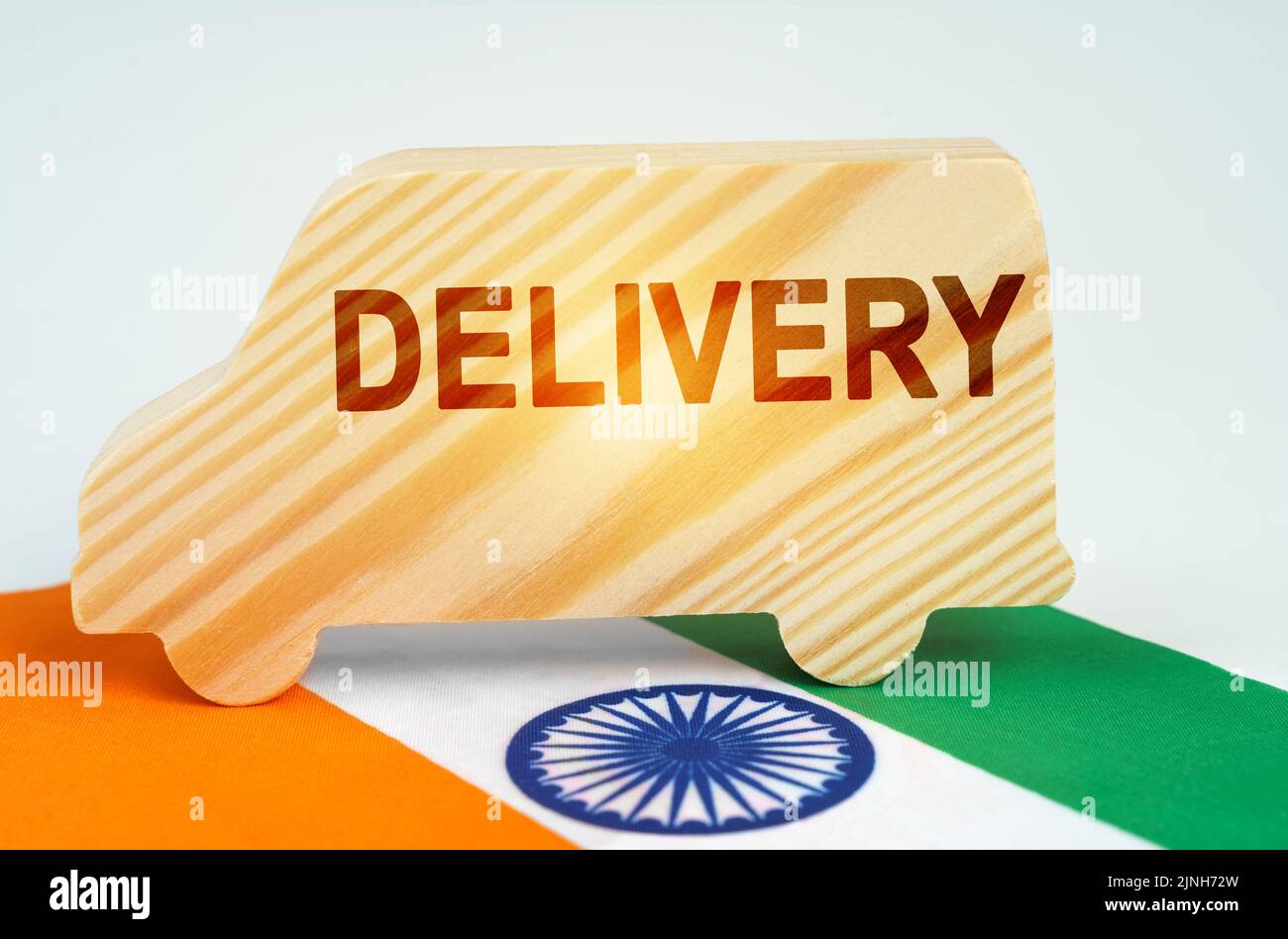The concept of cargo transportation and logistics. On the flag of India ...