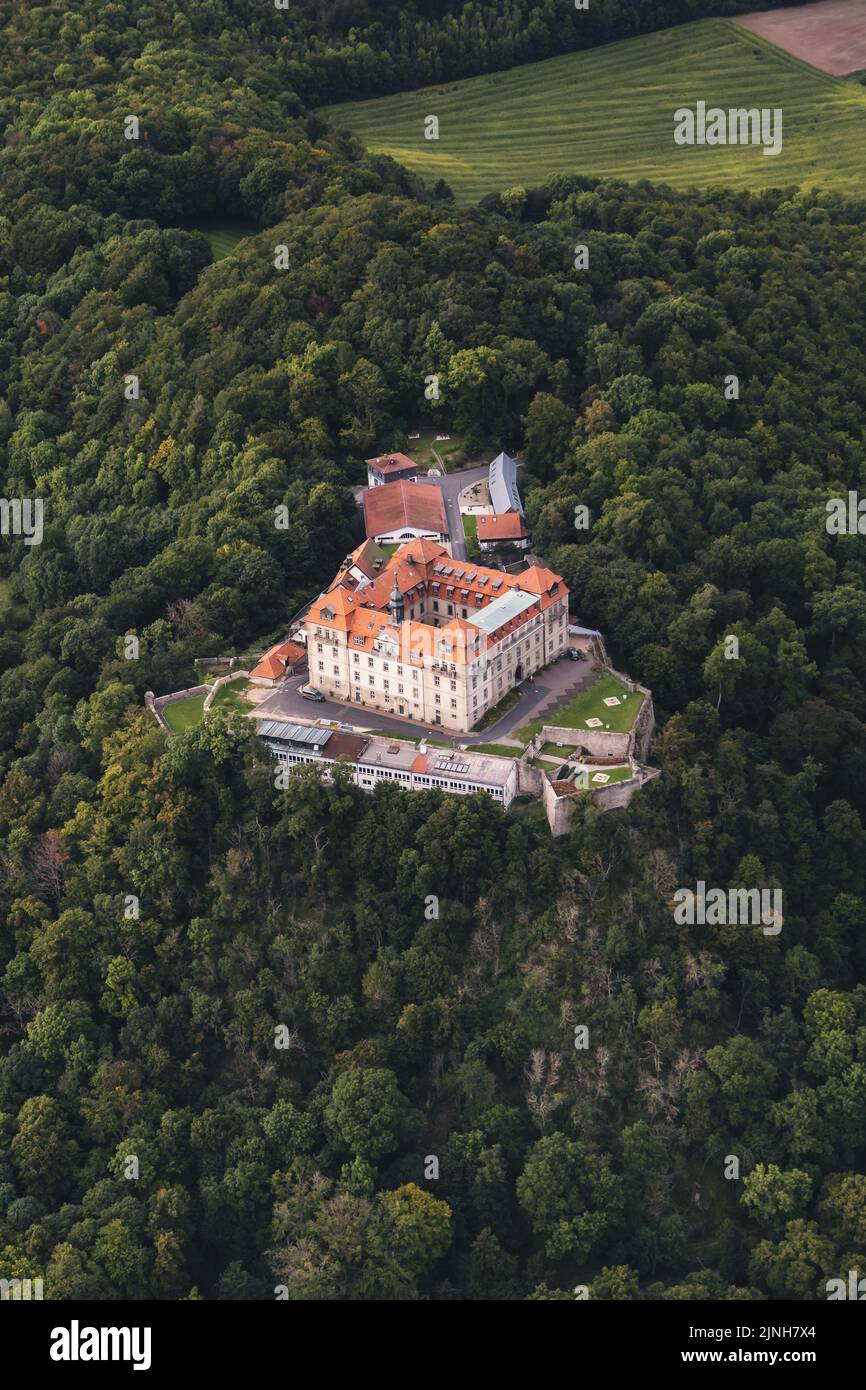 An aerial view of Bieberstein Castle with forest in Rhine, Germany ...