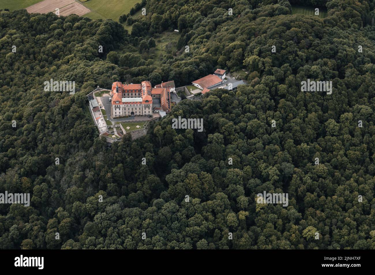 An aerial view of Bieberstein Castle with forest in Rhine, Germany ...
