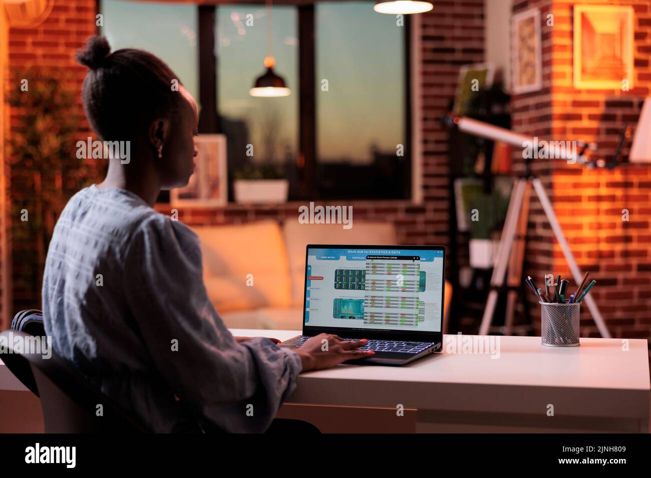 Financial analyst looking at data with company research results on ...