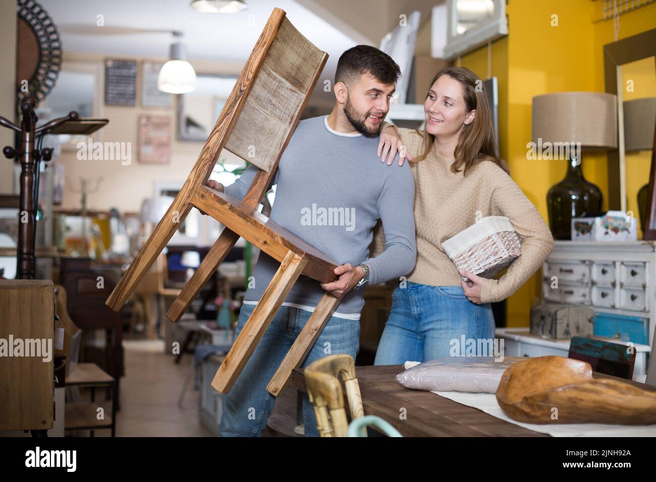 Couple arranging furniture in apartment Stock Photo - Alamy