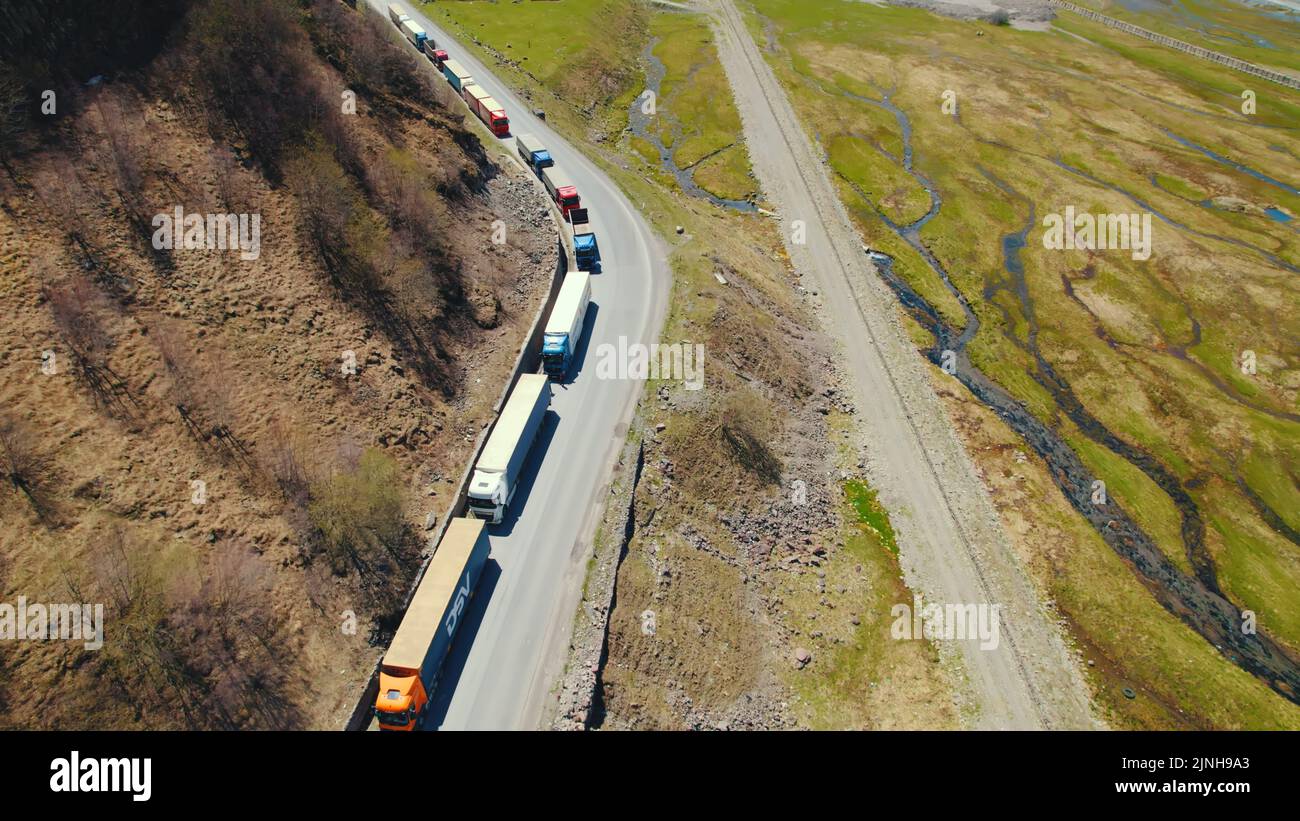 long queue of trucks on the border of Georgia and Russia, Kazbegi ...
